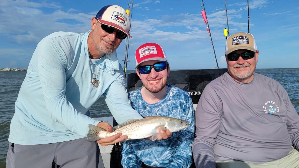 Tyler and Dad on Galveston Bay – TBO